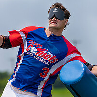 Chicago Comet Dustin Youngren hits a 4-foot-high padded base during a 2019 game in Indianapolis.