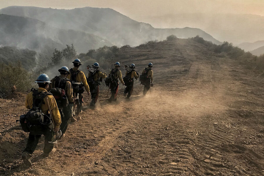 In southern California, firefighters work to prevent blaze from ...