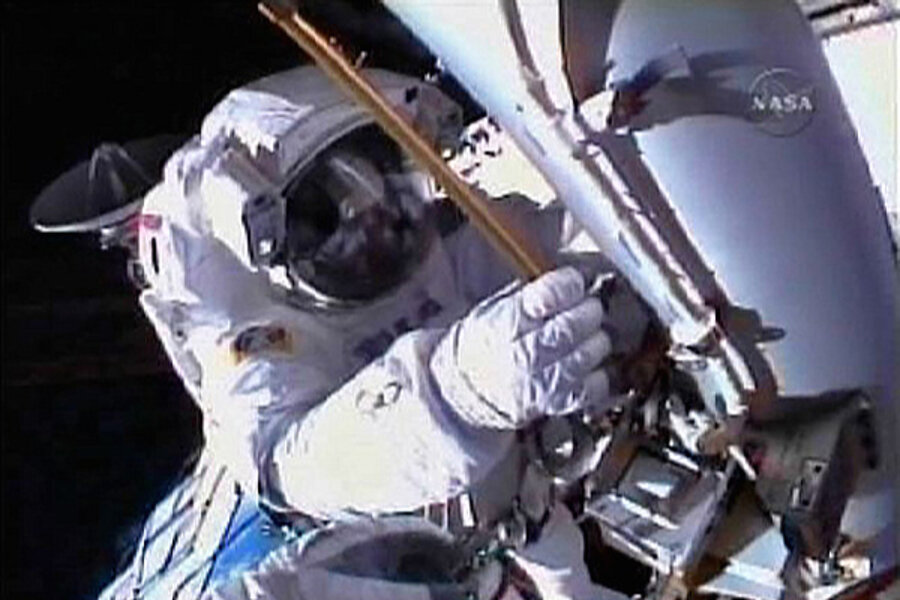 Discovery astronauts prepare to bottle outer space during spacewalk ...